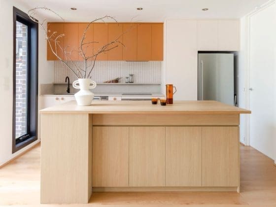 Evergreen: The orange kitchen with coloured joinery and grout